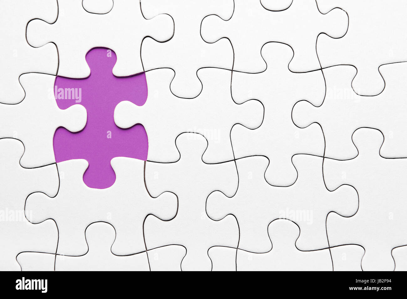 purple colored puzzle piece Stock Photo - Alamy