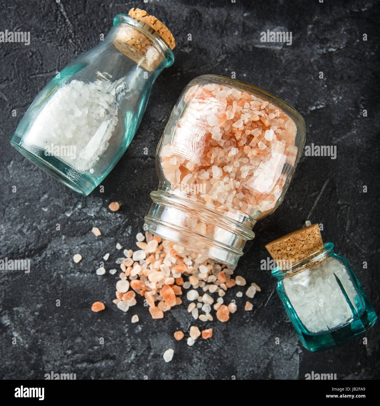 Small glass bottles with aromatic salt. Set for aromatherapy. Top view ...