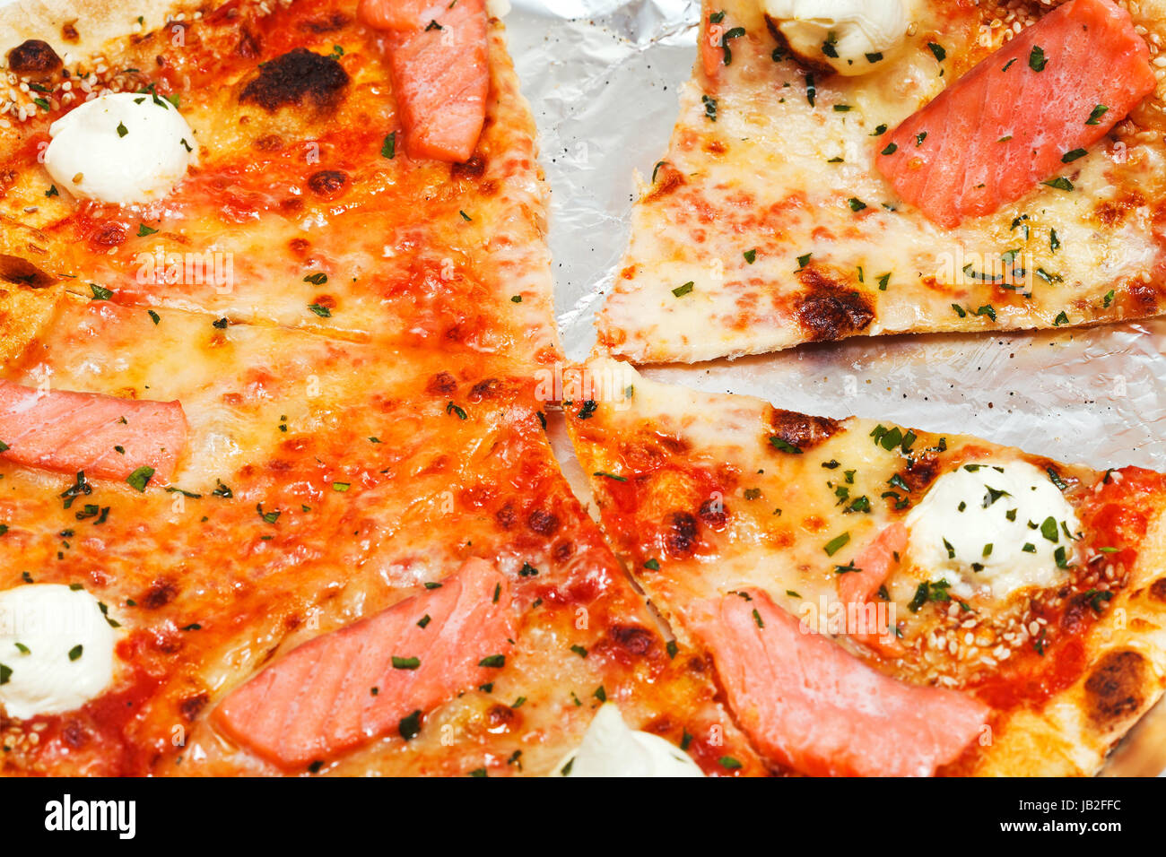 italian pizza with salmon fish in box close up Stock Photo - Alamy