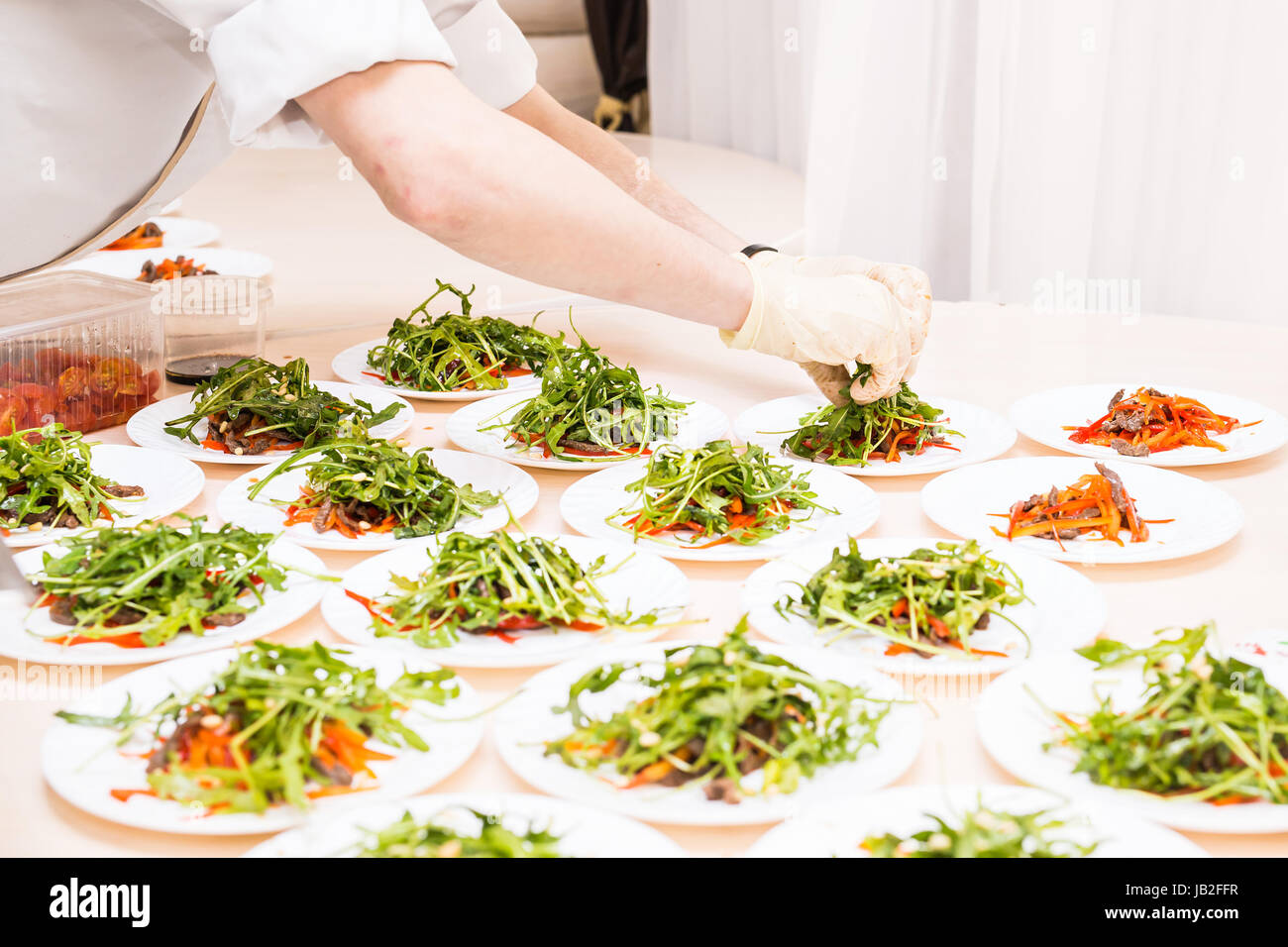 Close-up of chef cooking food kitchen restaurant cutting cook hands ...