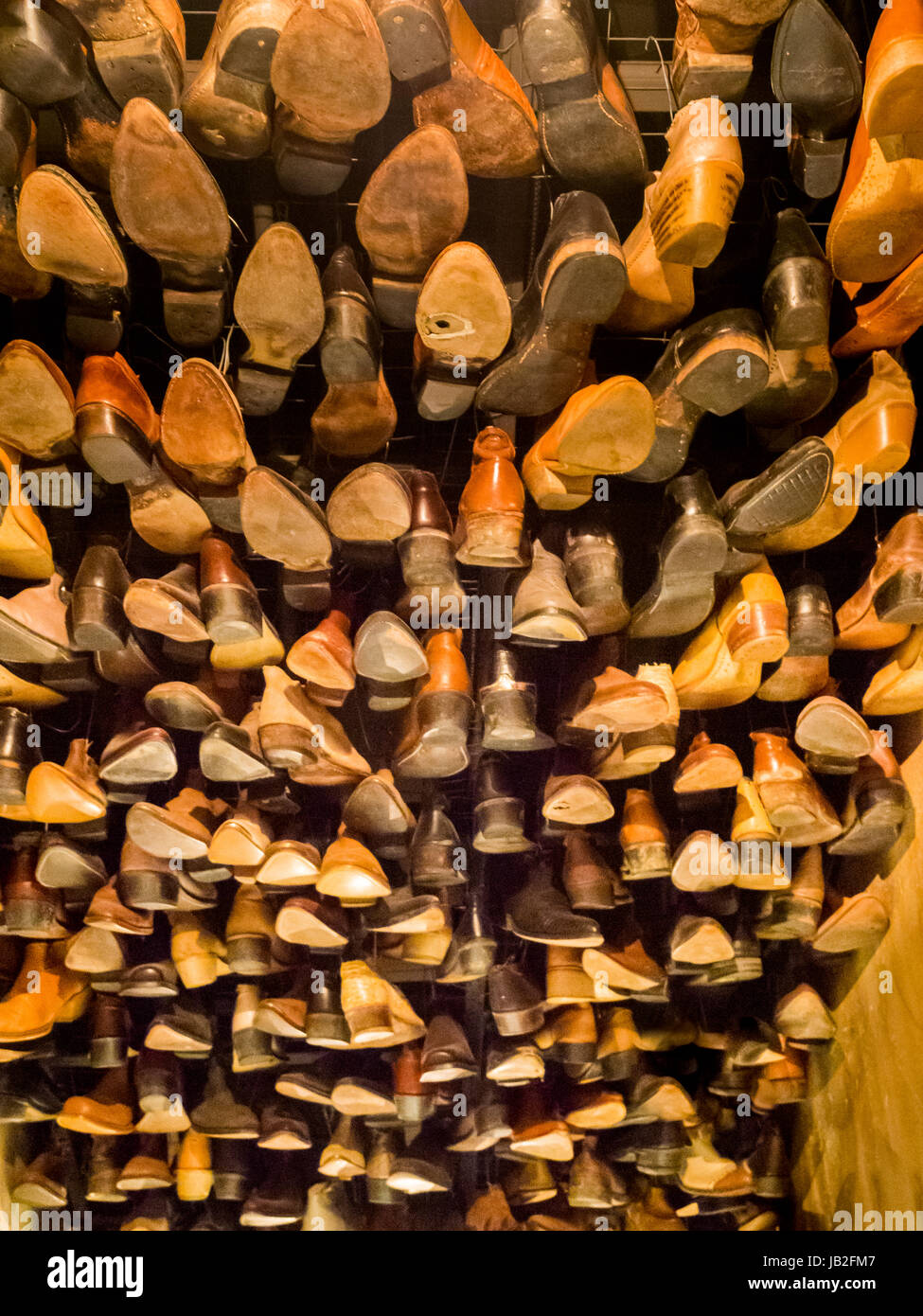 old cowboy boots hang from the ceiling in a club in nashville ...