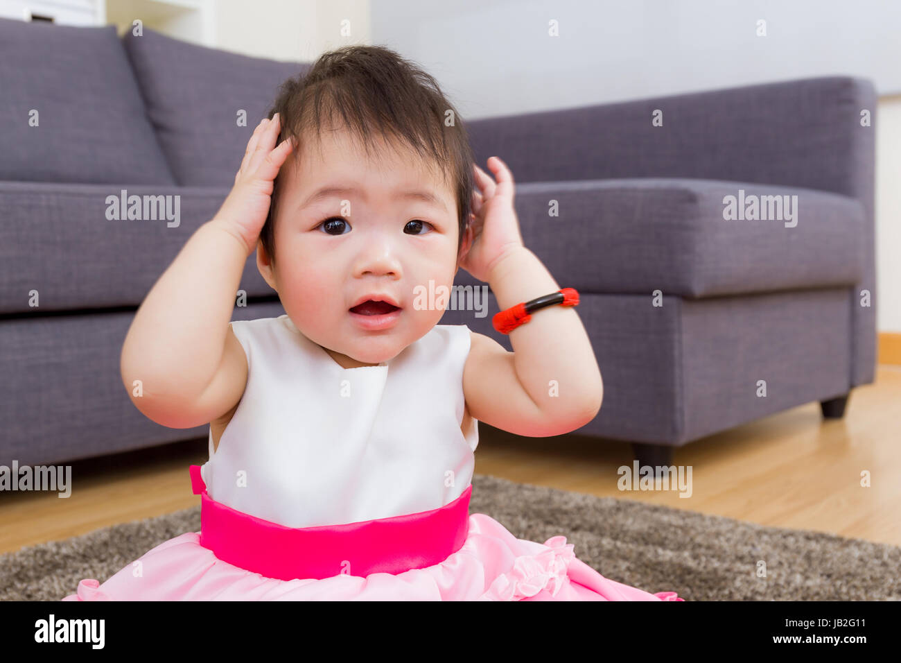 Little girl hand cover ear Stock Photo - Alamy