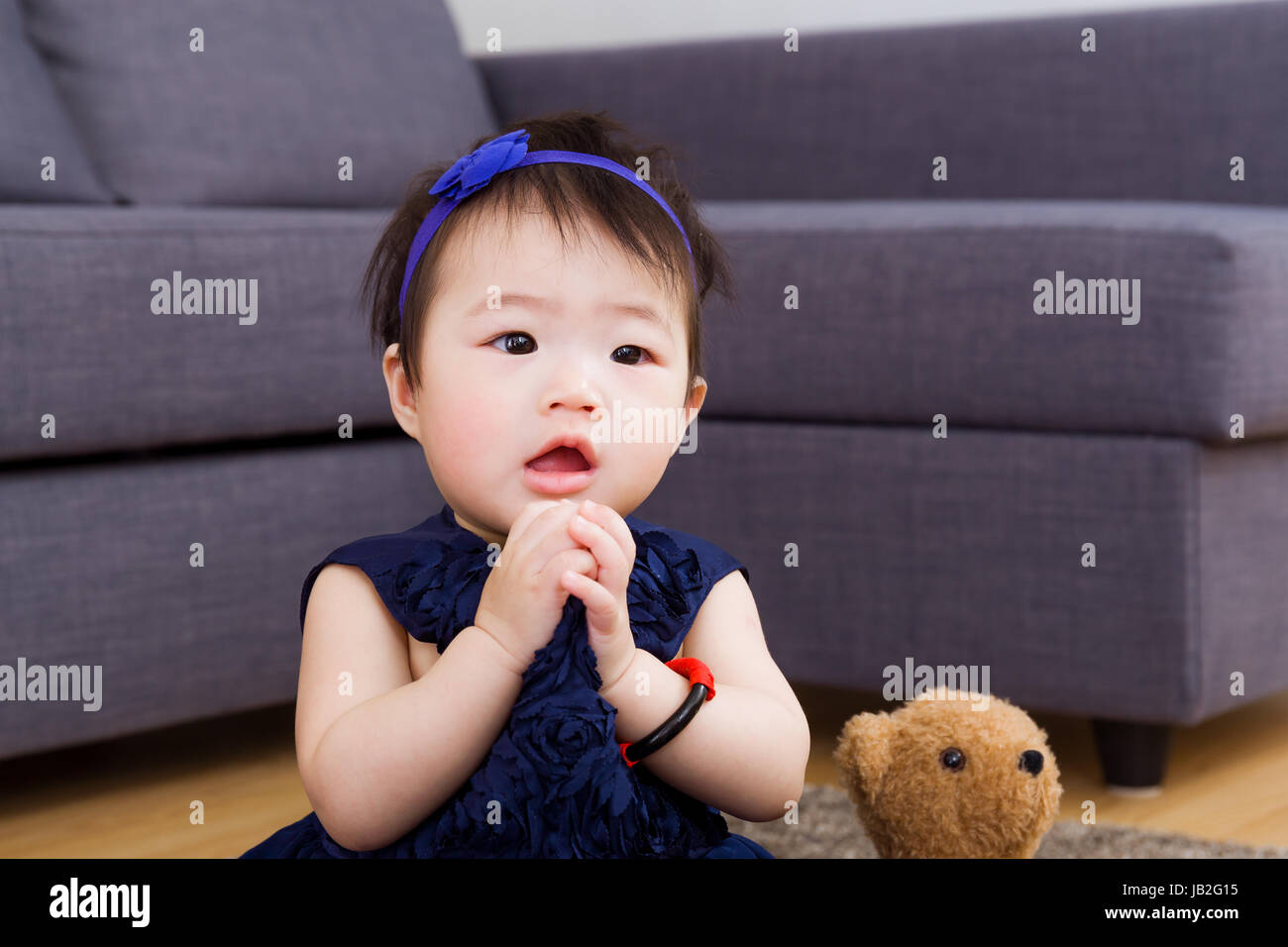 Baby girl pray Stock Photo - Alamy
