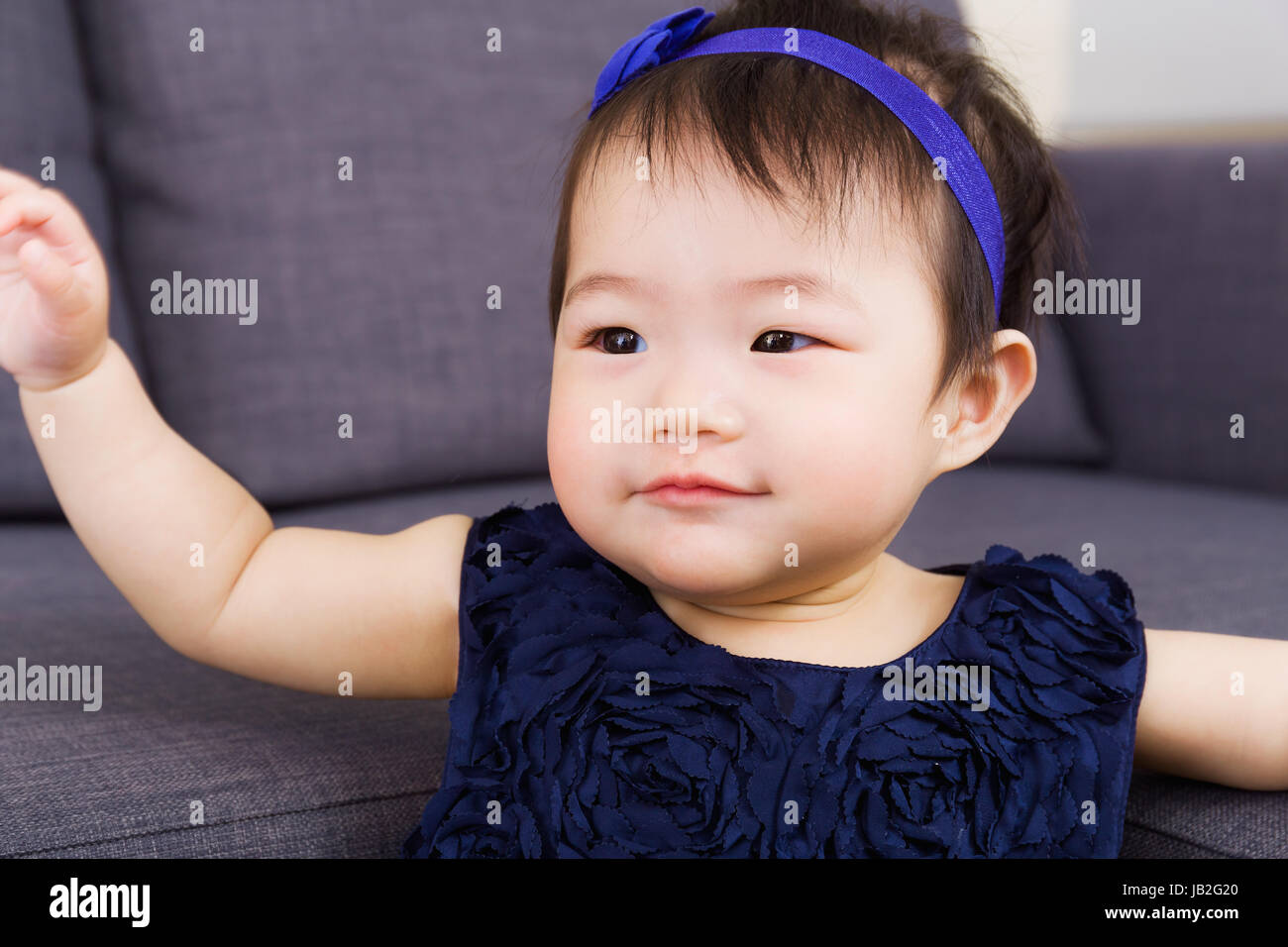 Baby girl hand up Stock Photo - Alamy