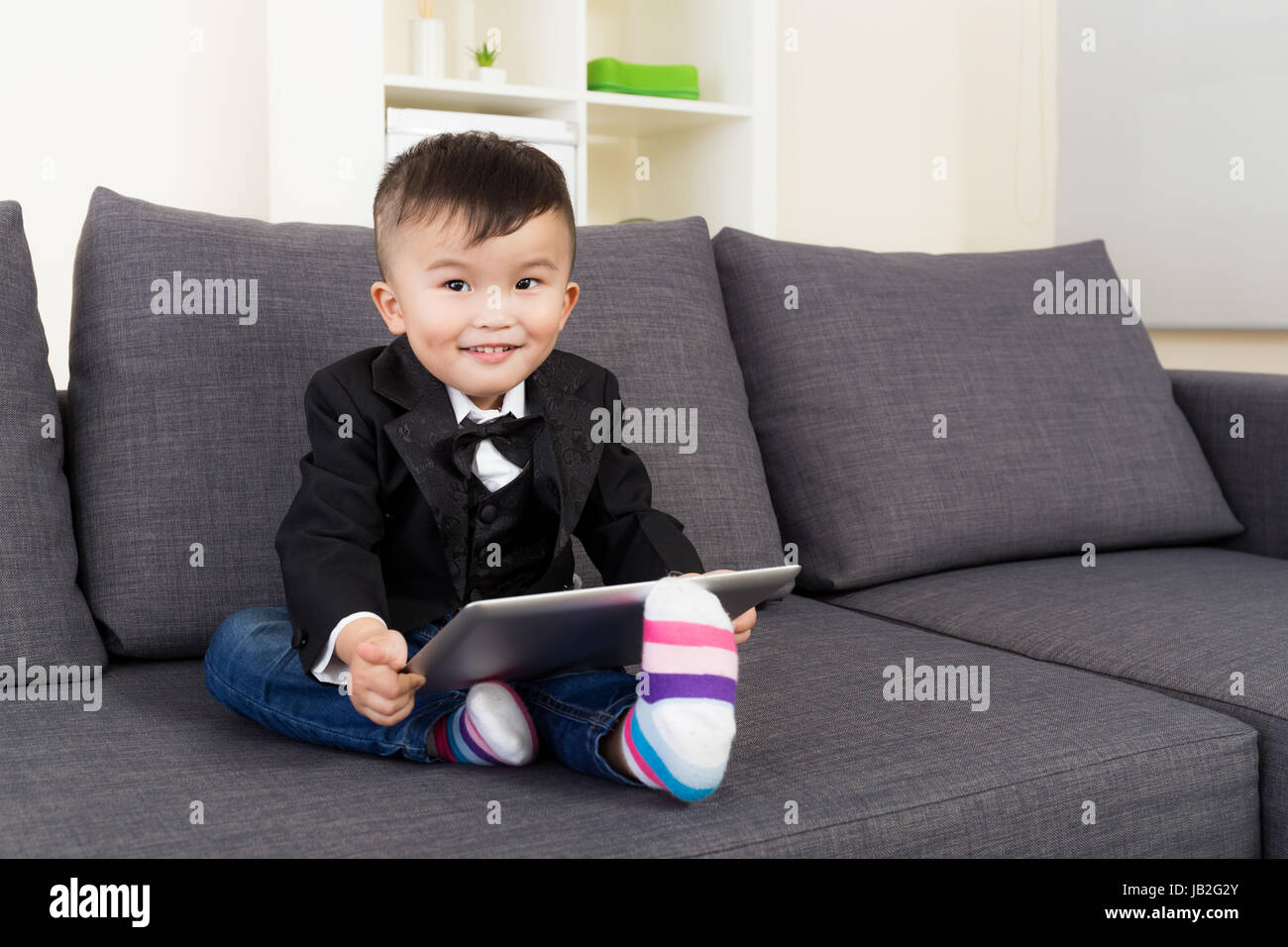 Little boy using tablet Stock Photo - Alamy