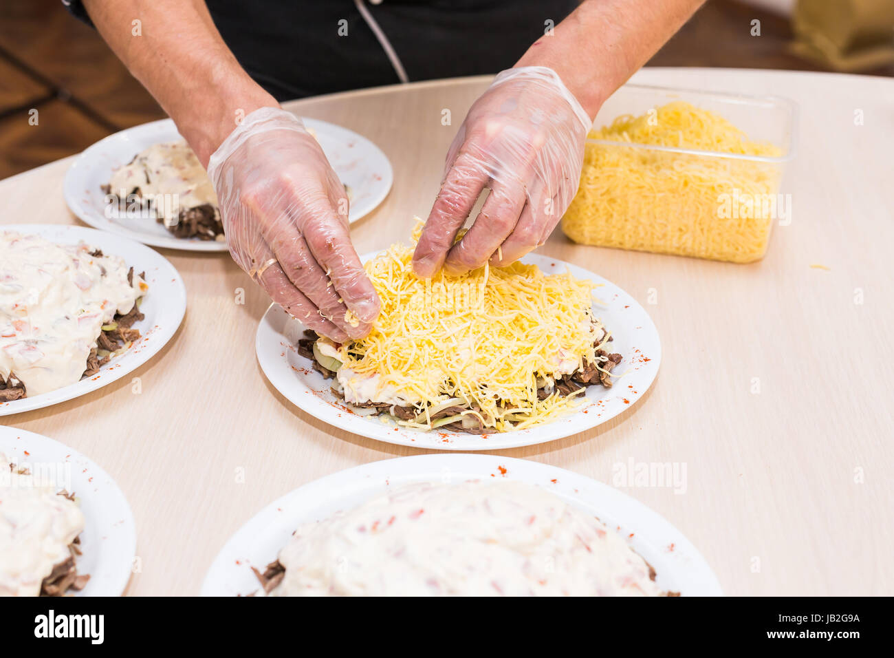 Close-up of chef cooking food kitchen restaurant cutting cook hands ...
