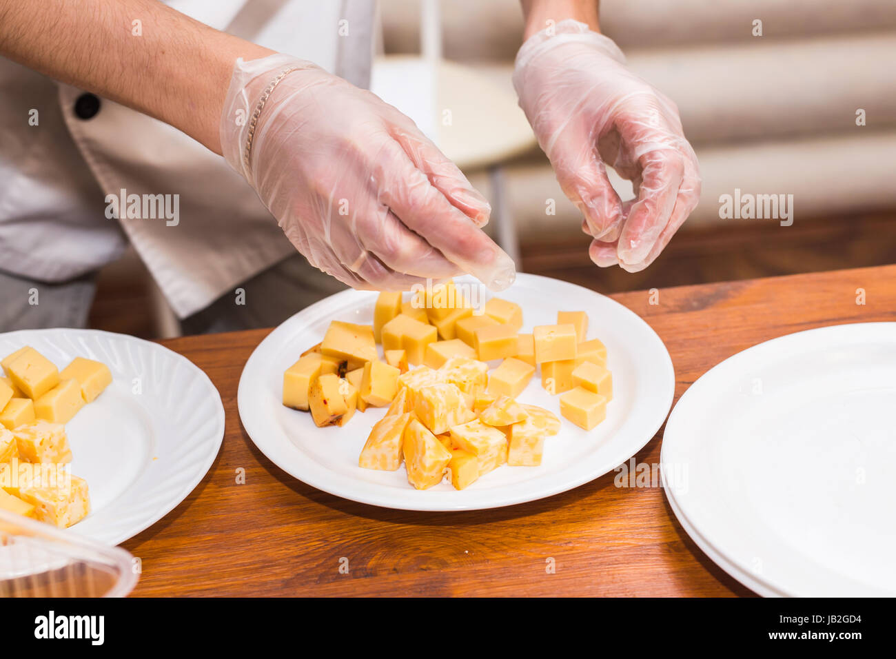 Close-up of chef cooking food kitchen restaurant cutting cook hands ...