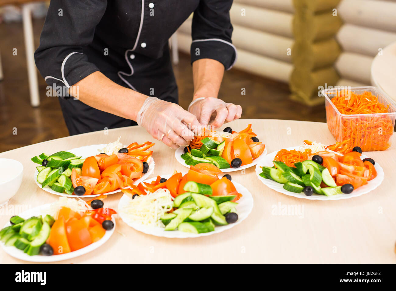 Close-up of chef cooking food kitchen restaurant cutting cook hands ...
