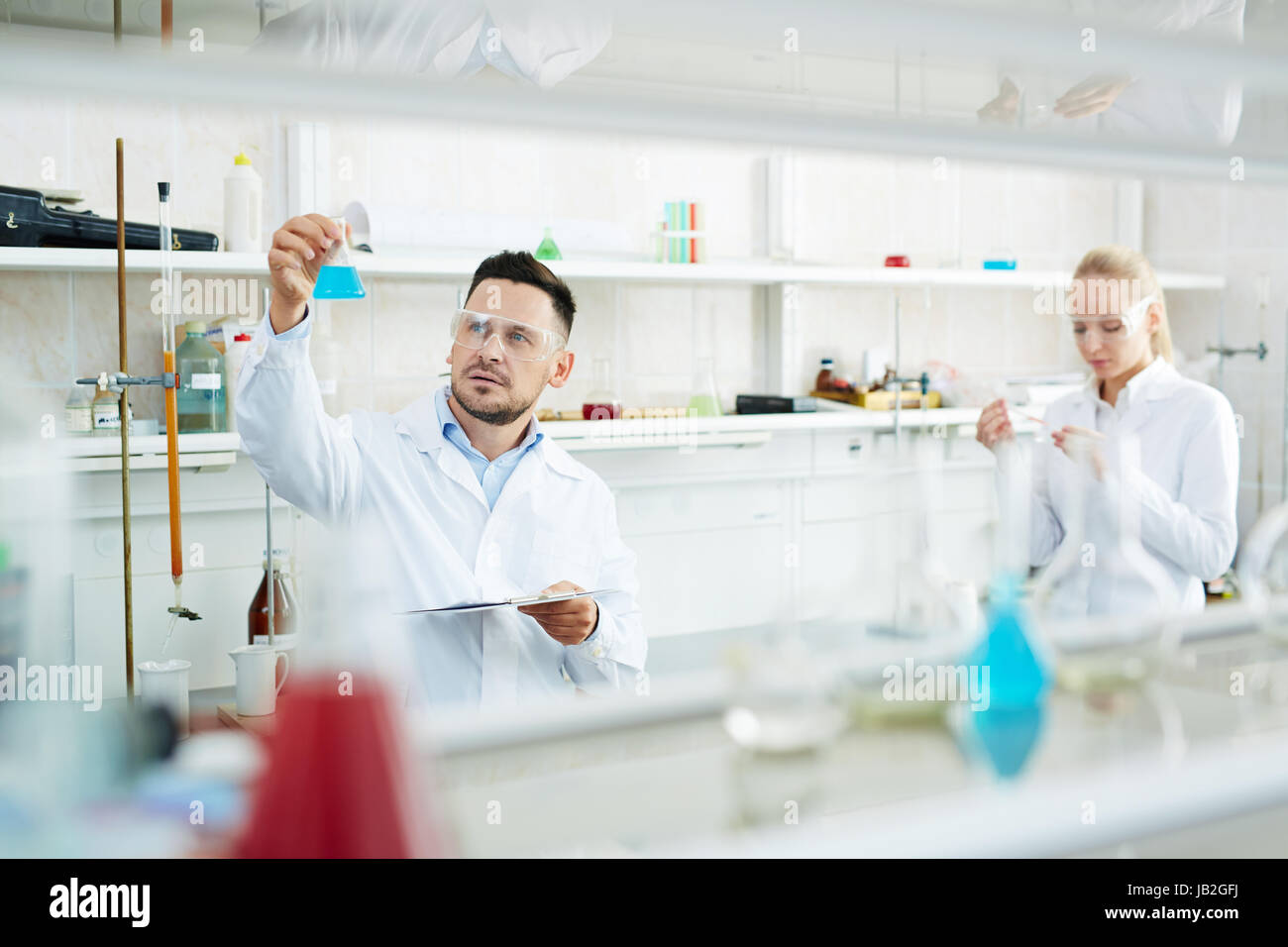 Team of Scientists Working in Chemical Laboratory Stock Photo - Alamy