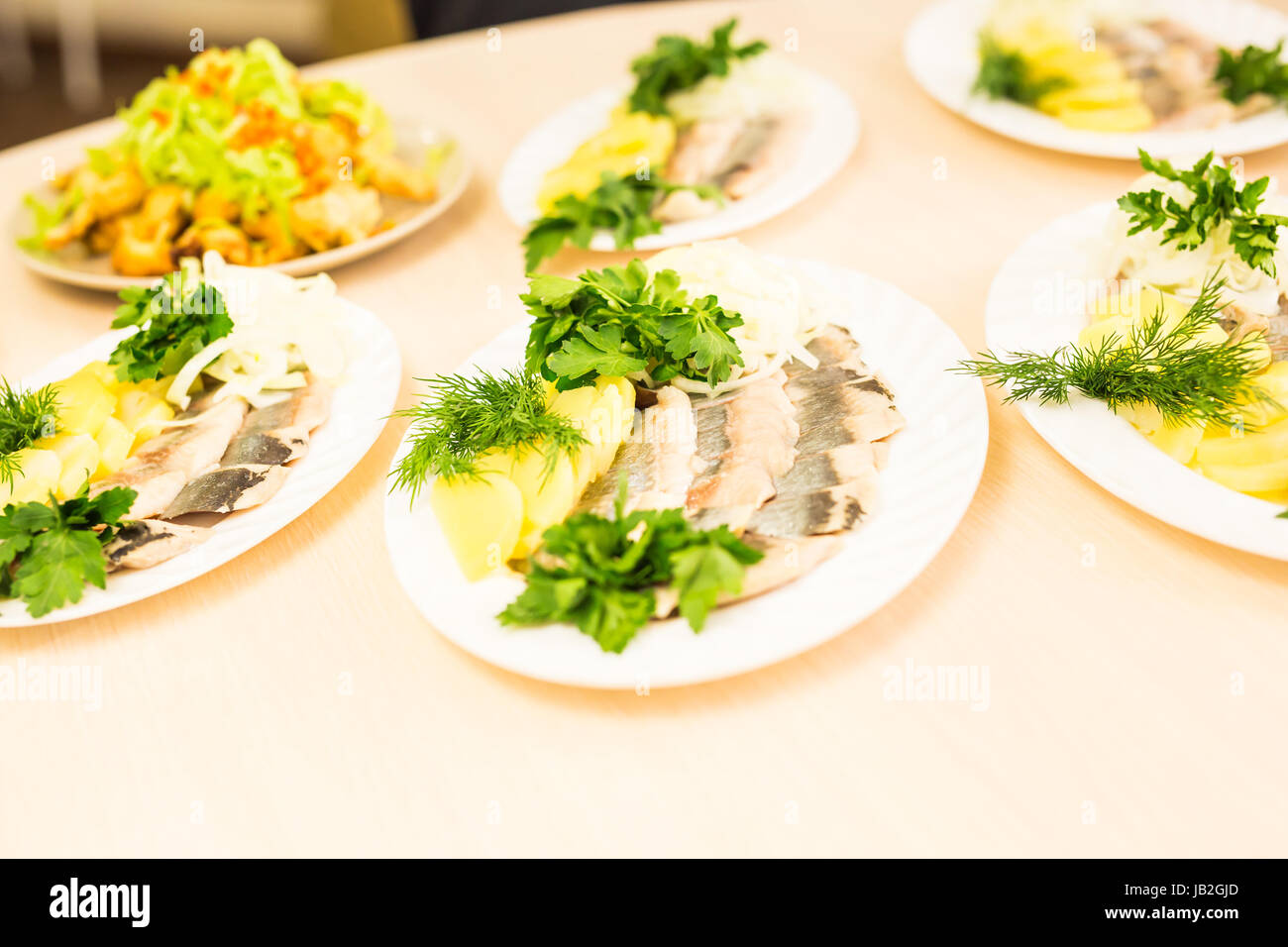 Dish with sliced fish products on the festive table Stock Photo - Alamy