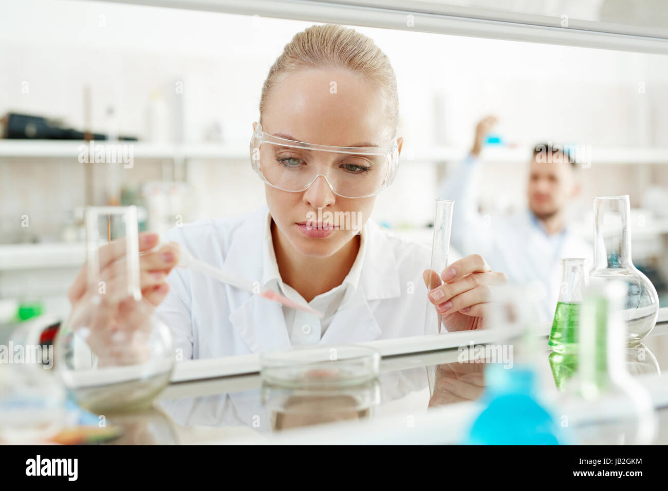 Woman Scientist Performing Experiment in Laboratory Stock Photo - Alamy