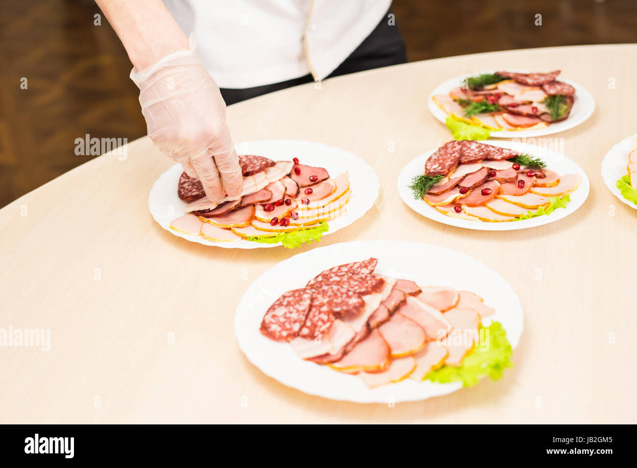 Close-up of chef cooking food kitchen restaurant cutting cook hands ...
