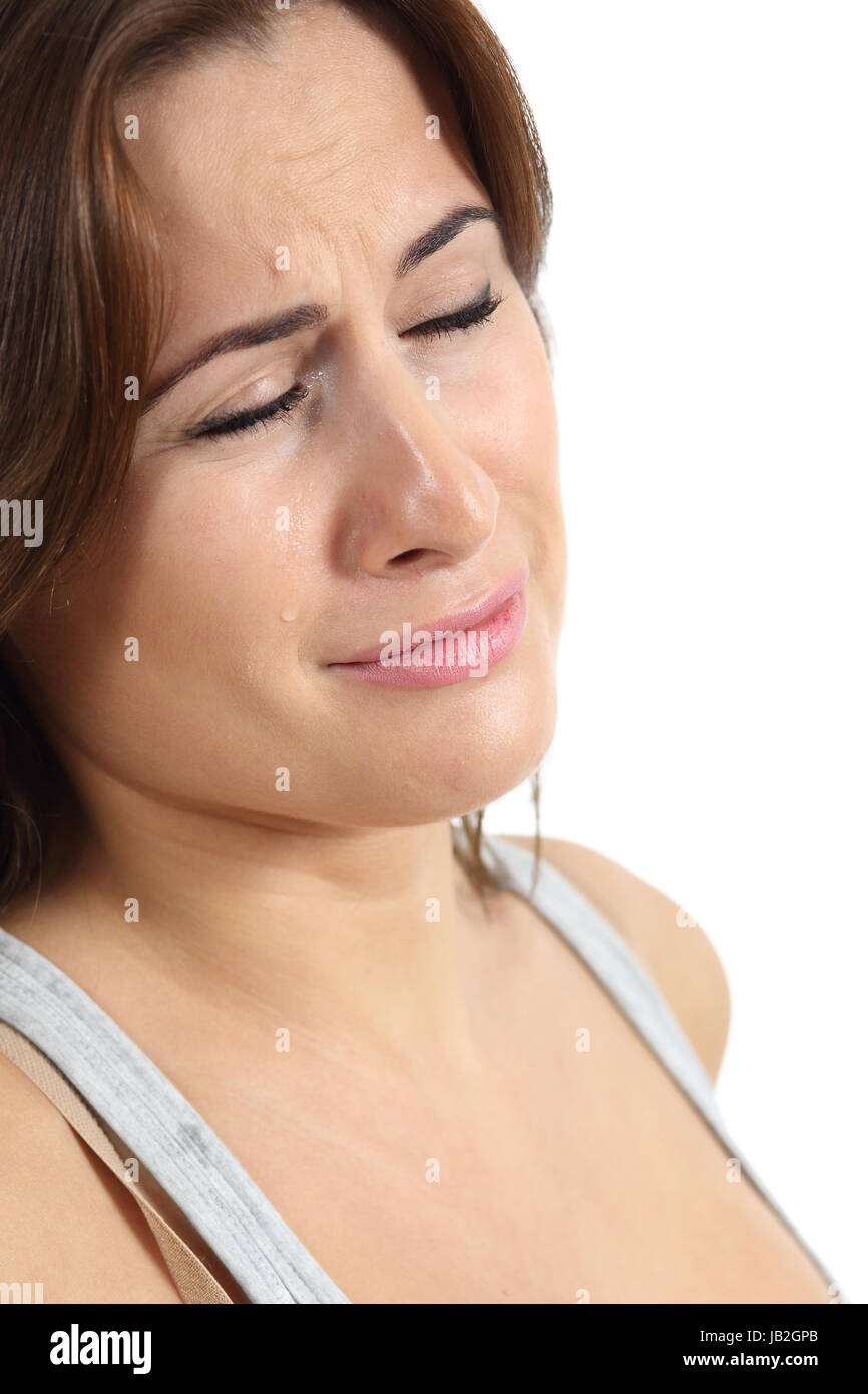 Portrait of a woman crying in tears isolated on a white background ...