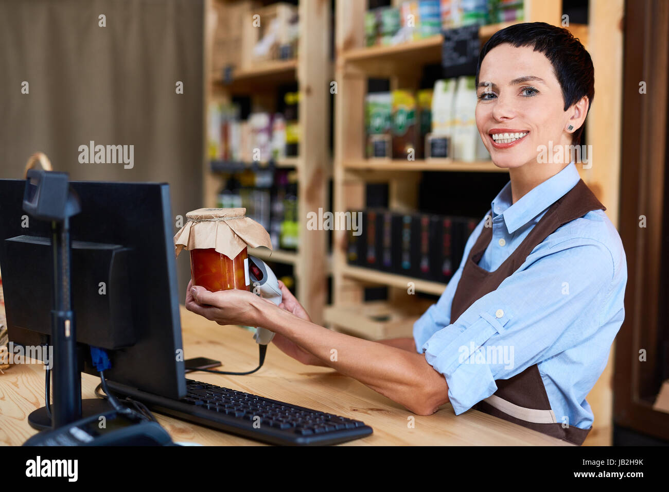 Cashier scanning barcode hi-res stock photography and images - Alamy