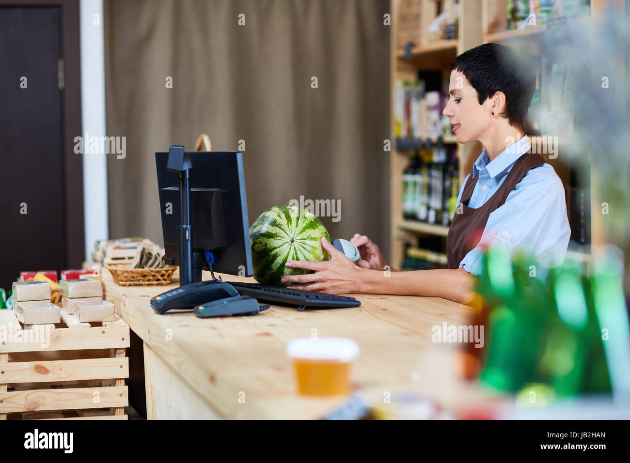 Attractive Checkout Operator at Work Stock Photo - Alamy