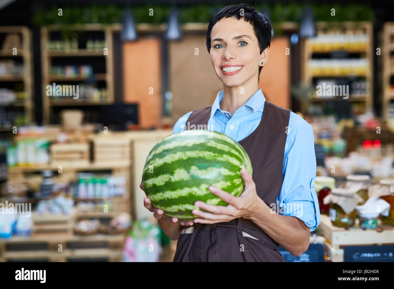 Shop Owner with Watermelon Stock Photo - Alamy