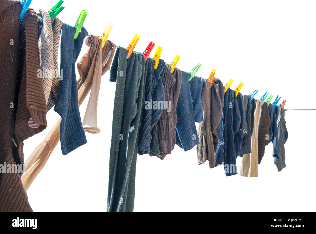 Socks drying on clothesline, isolated on white background Stock Photo ...