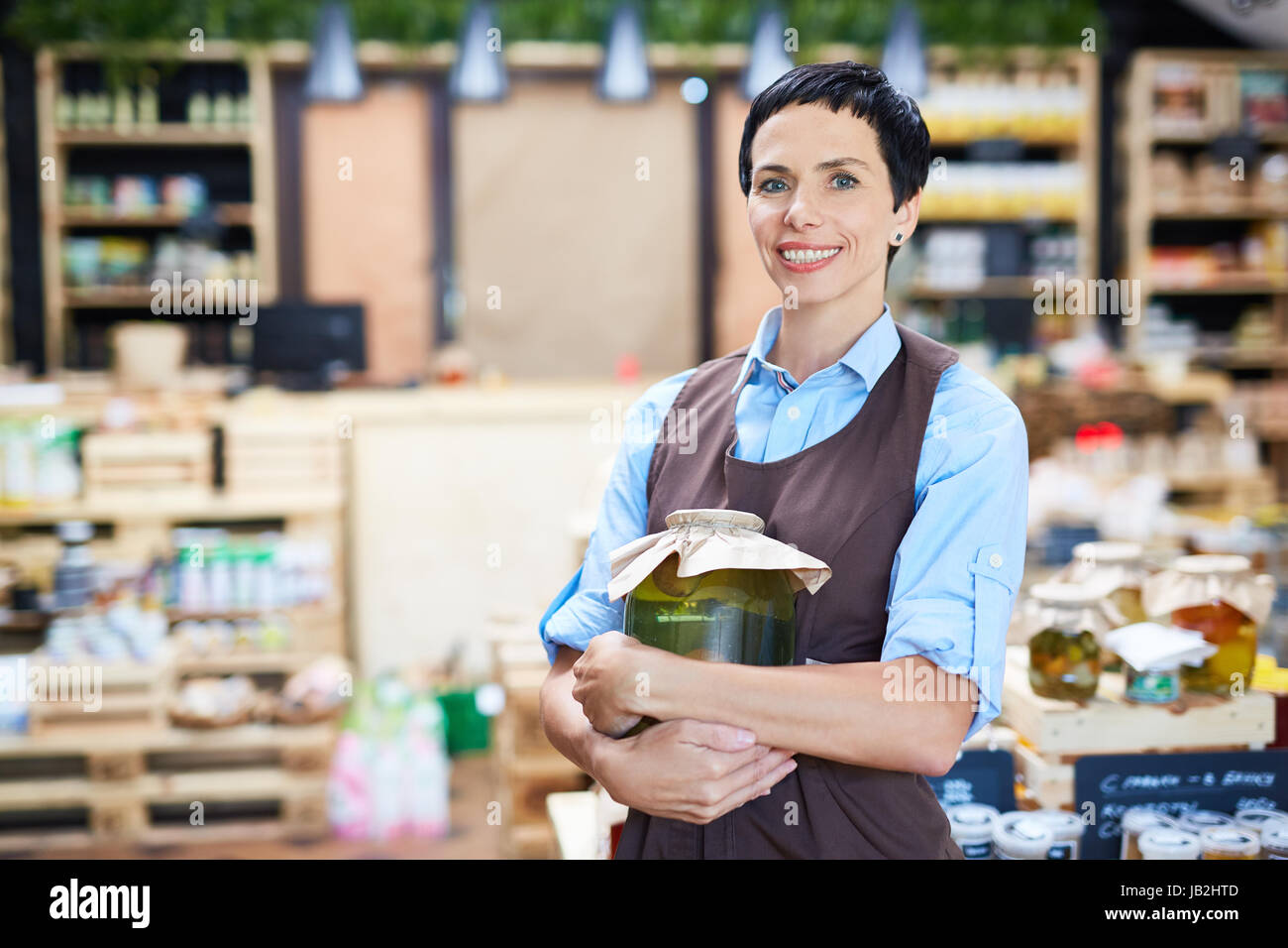 Friendly Shop Owner at Work Stock Photo - Alamy