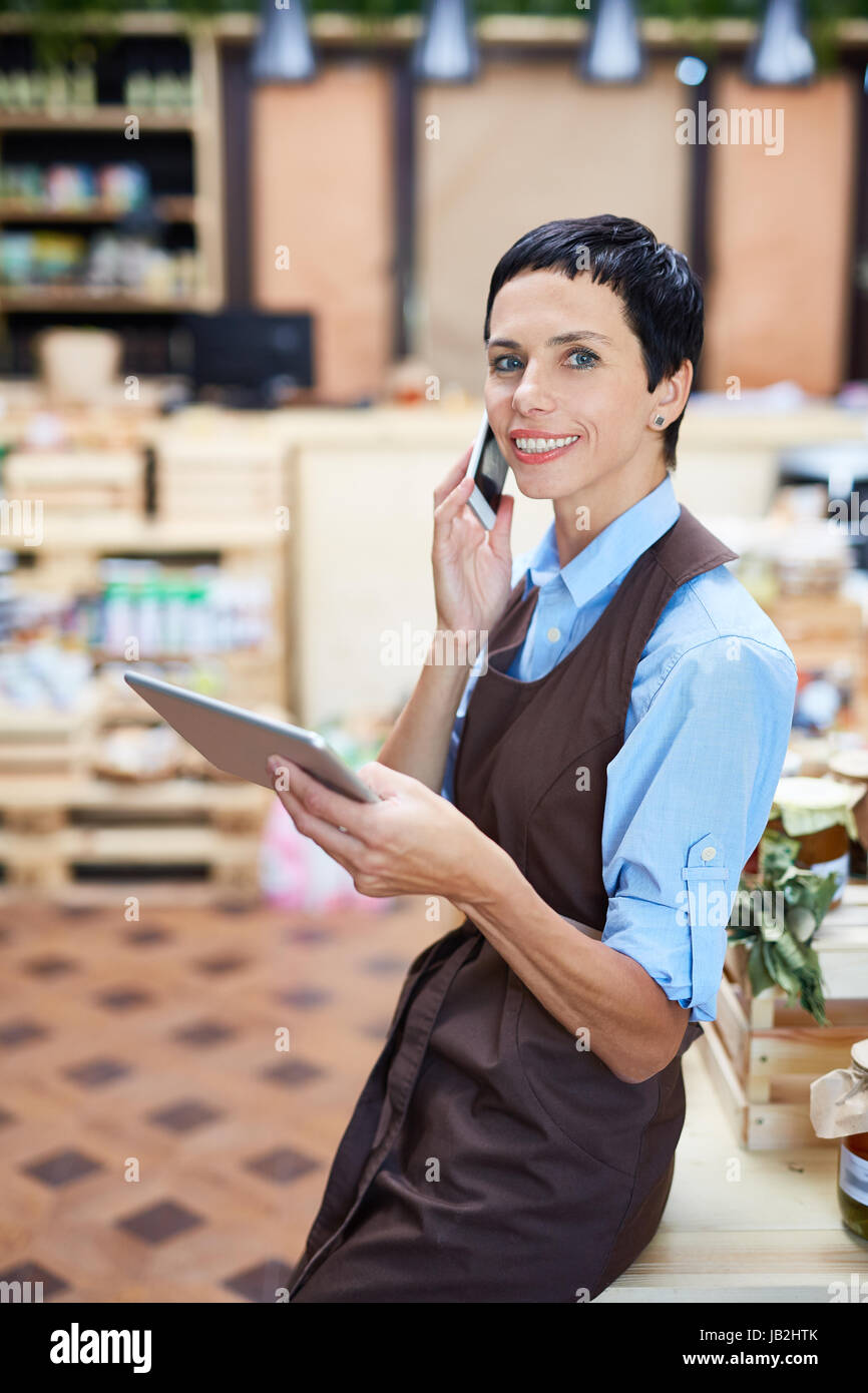 Woman customer talking shop assistant hi-res stock photography and ...