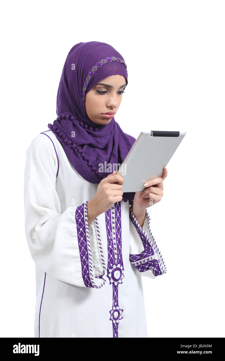 Arab woman bored reading a tablet reader isolated on a white background ...