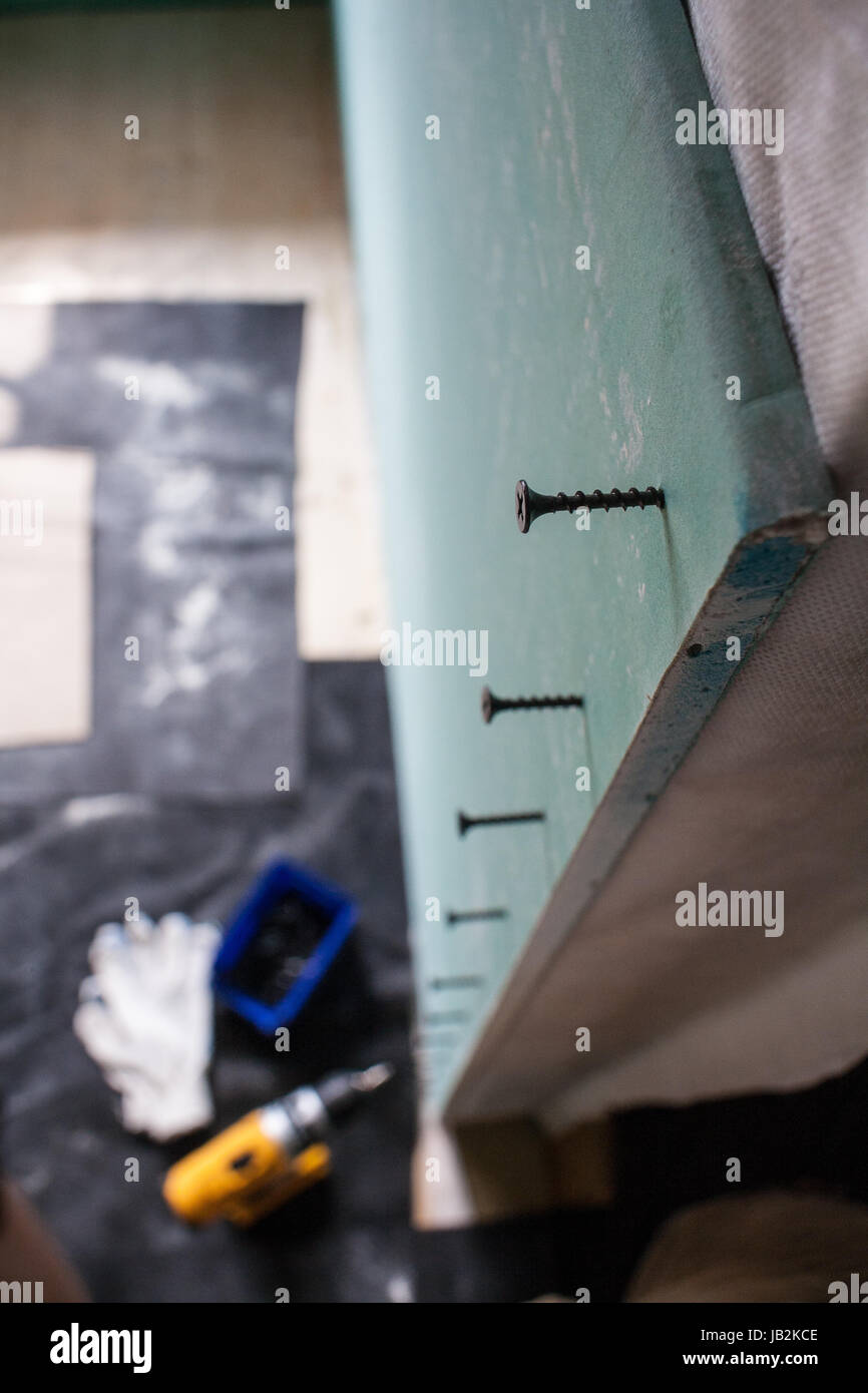 interior house alterations works Drywall Construction worker holding ...