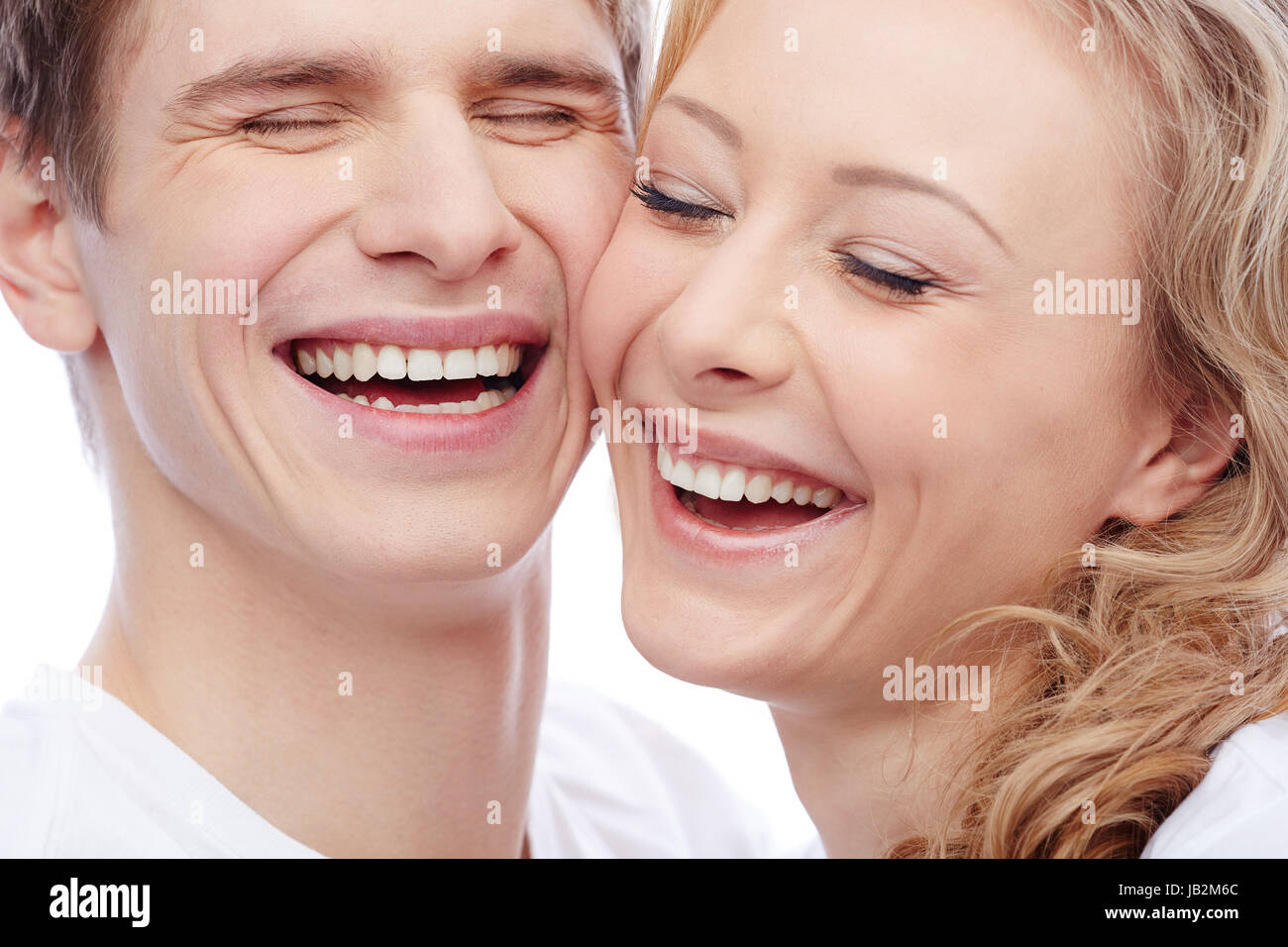 Faces of amorous young couple laughing with closed eyes Stock Photo - Alamy