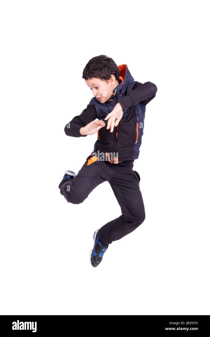 Young boy jumping isolated in white Stock Photo - Alamy
