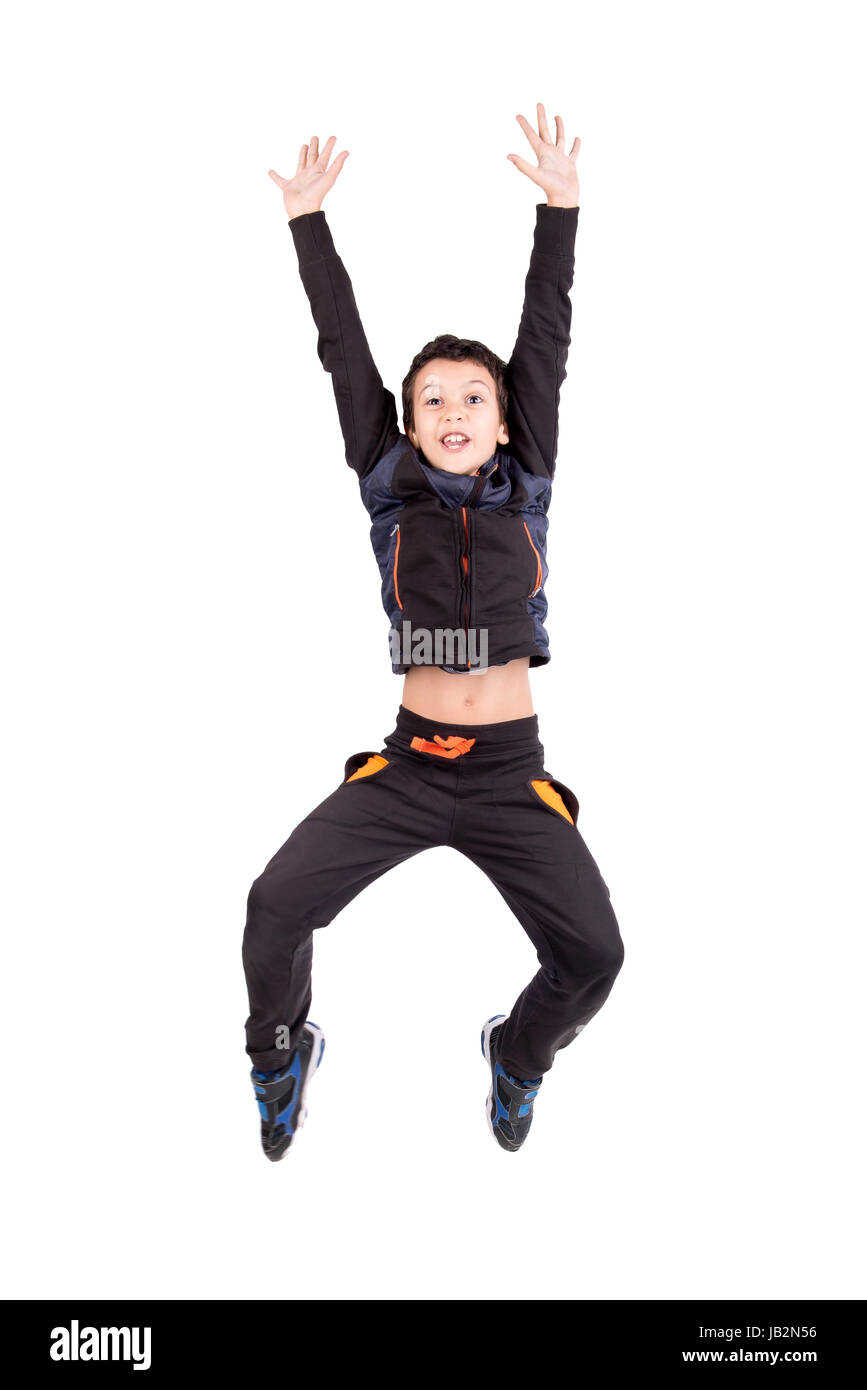 Young boy jumping isolated in white Stock Photo - Alamy