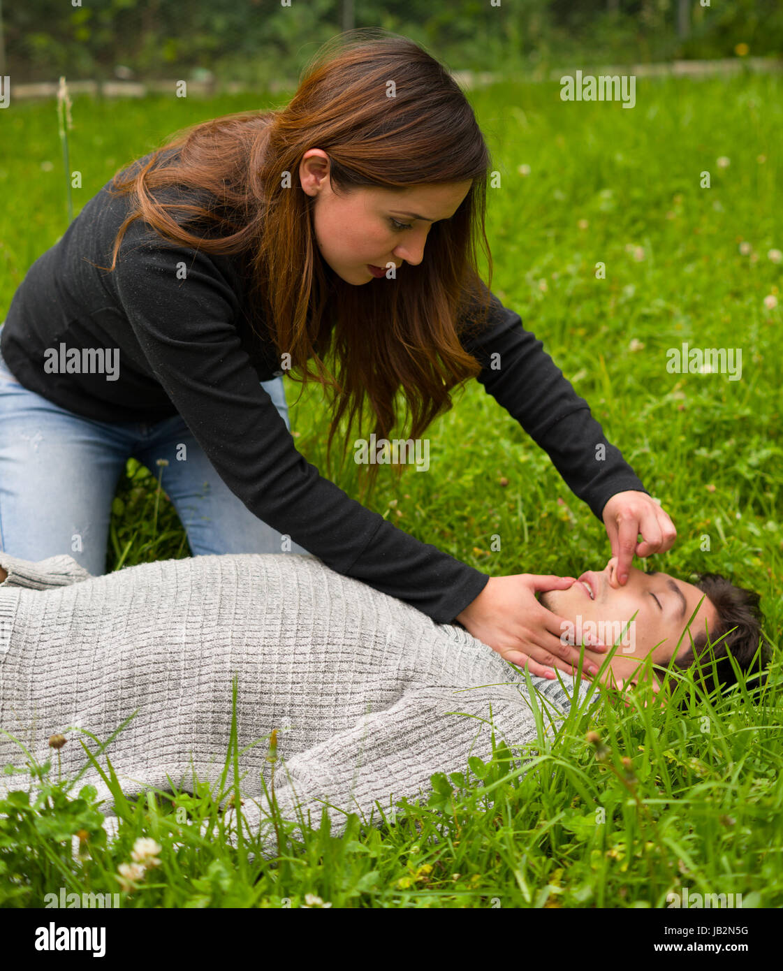 Beautiful women giving first aid, cardiopulmonary resuscitation, in a ...