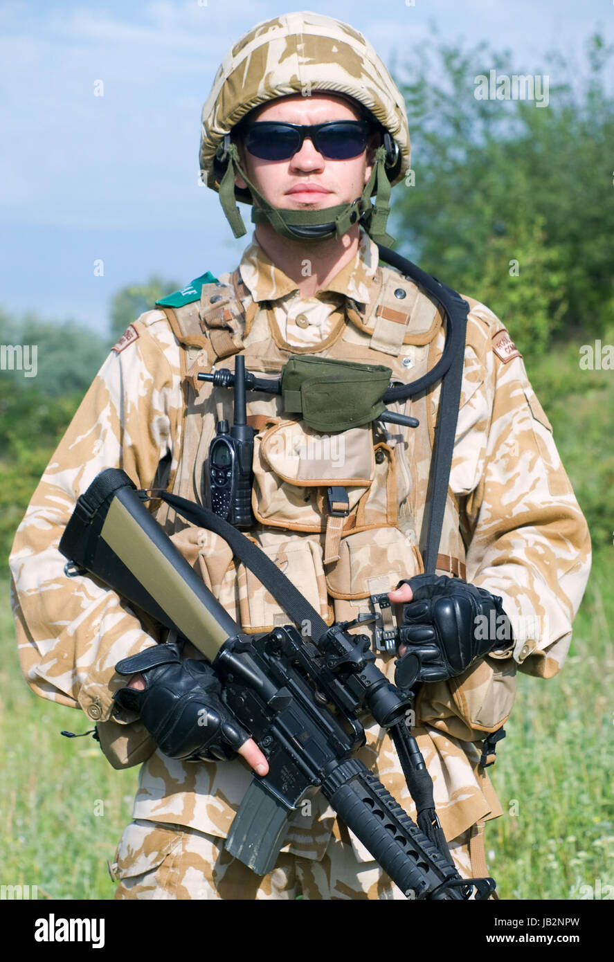 British Royal Commando in desert uniform holding his rifle Stock Photo ...