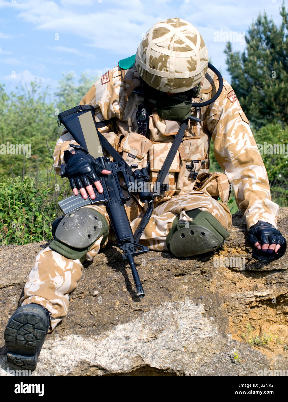 British soldier in desert uniform sitting wounded Stock Photo - Alamy