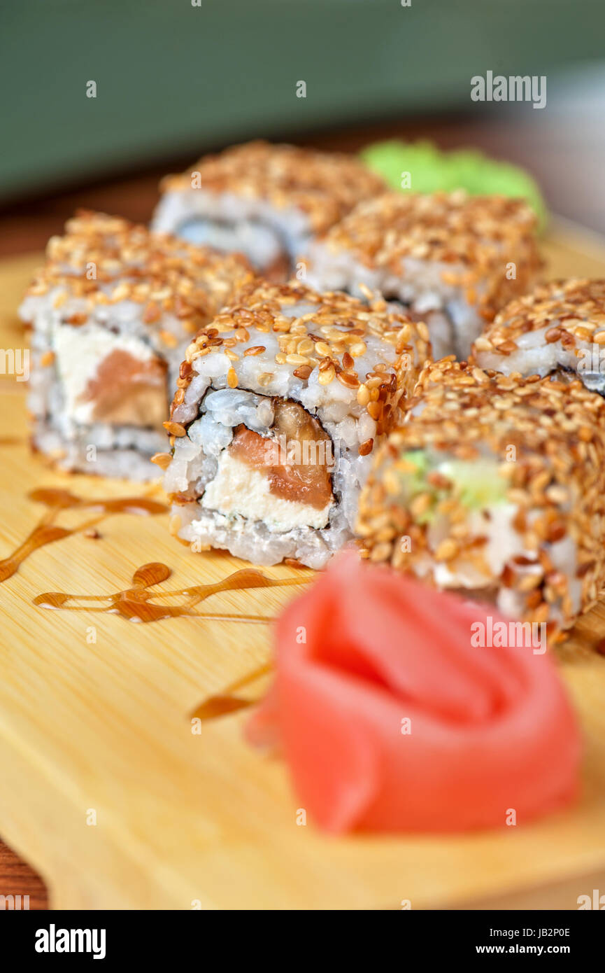 Japanese cuisine - sesame sushi rolls with syrup Stock Photo - Alamy