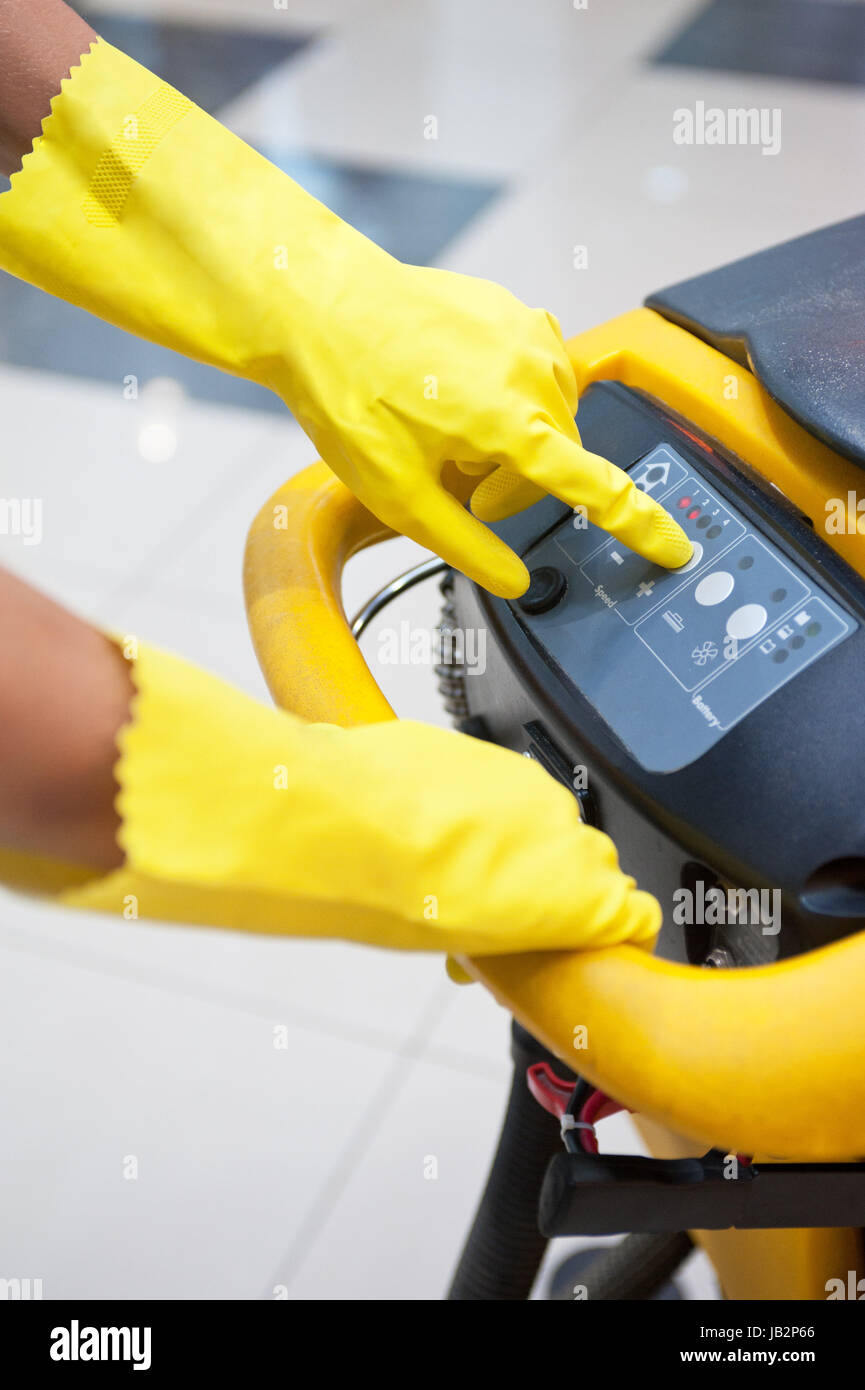 Cleaner workers with mop in uniform cleaning floor Stock Photo - Alamy