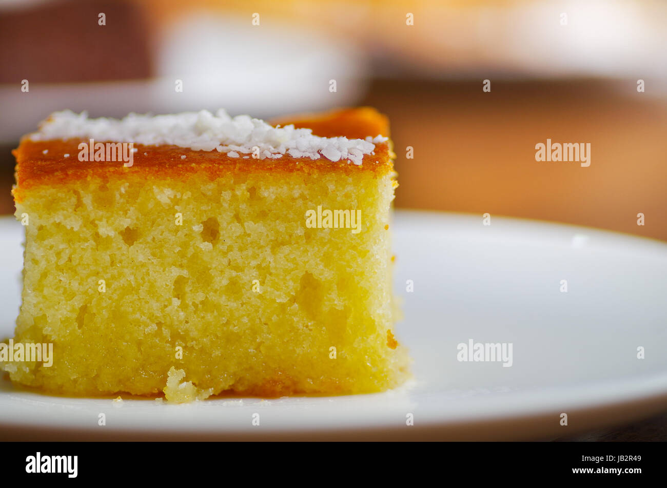 Delicious turkish pastry with syrup revani over a white plate Stock ...