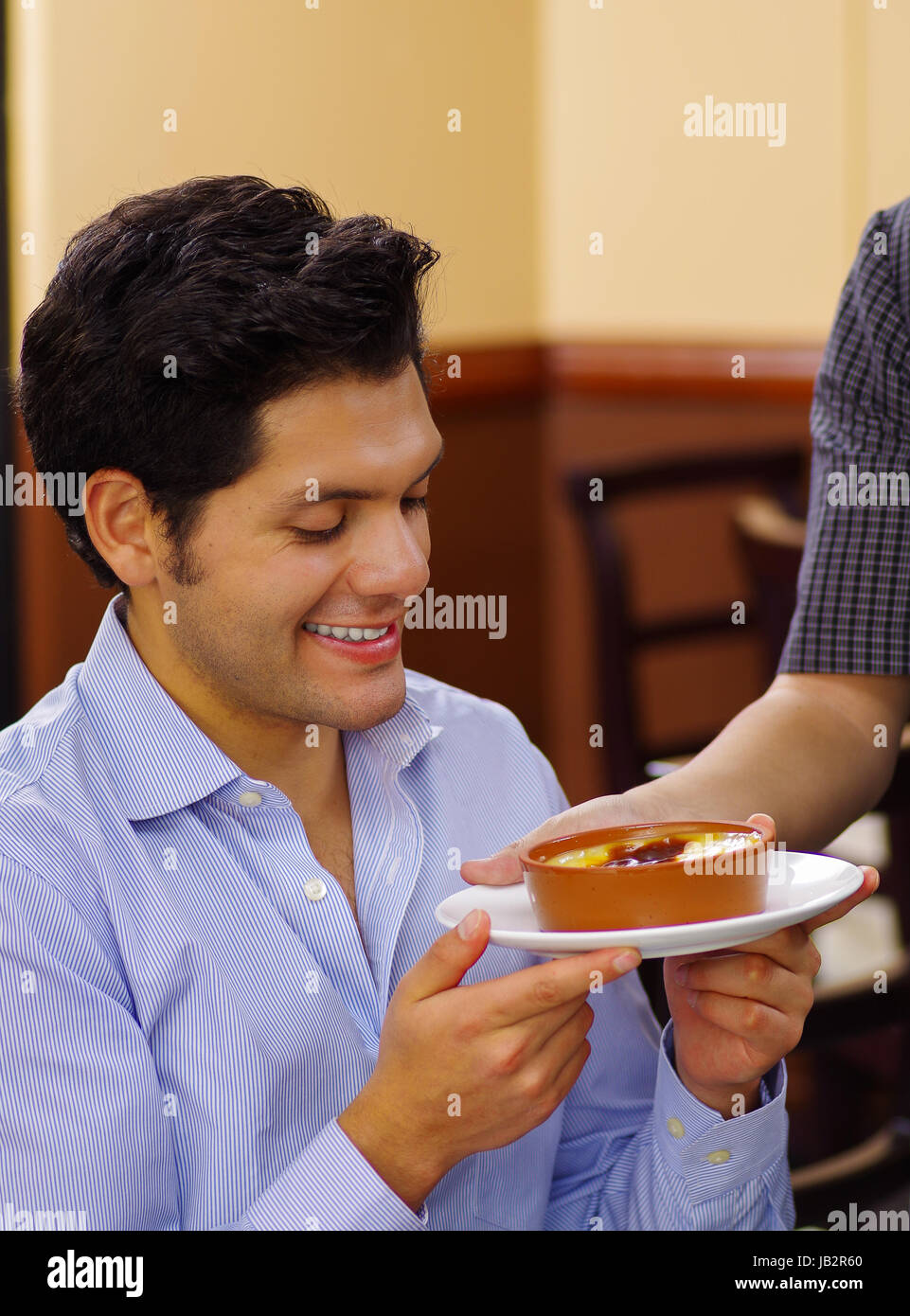 Handsome man is going to eat a turkish traditional dairy style rice ...