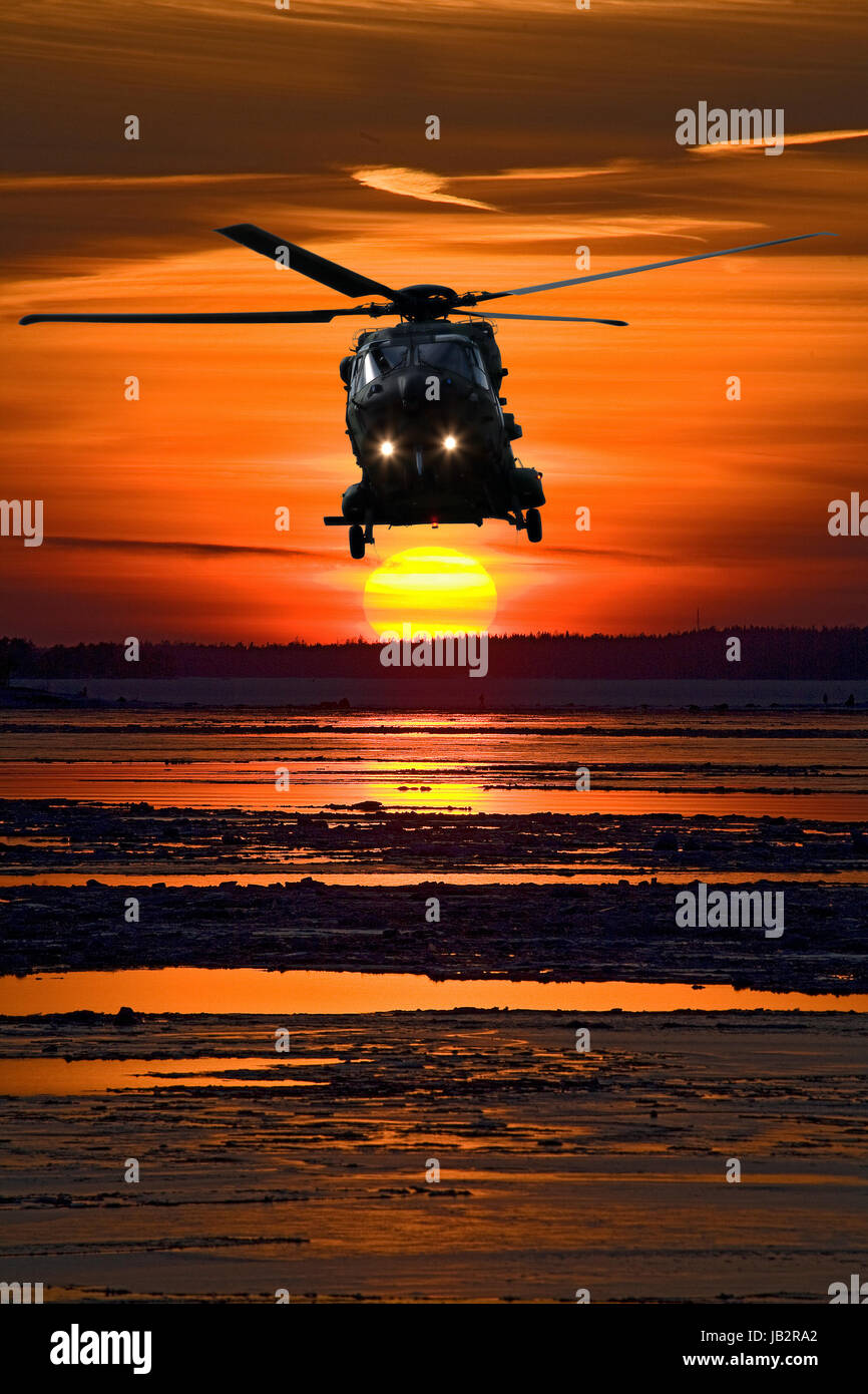 Helicopter at sunset Stock Photo - Alamy