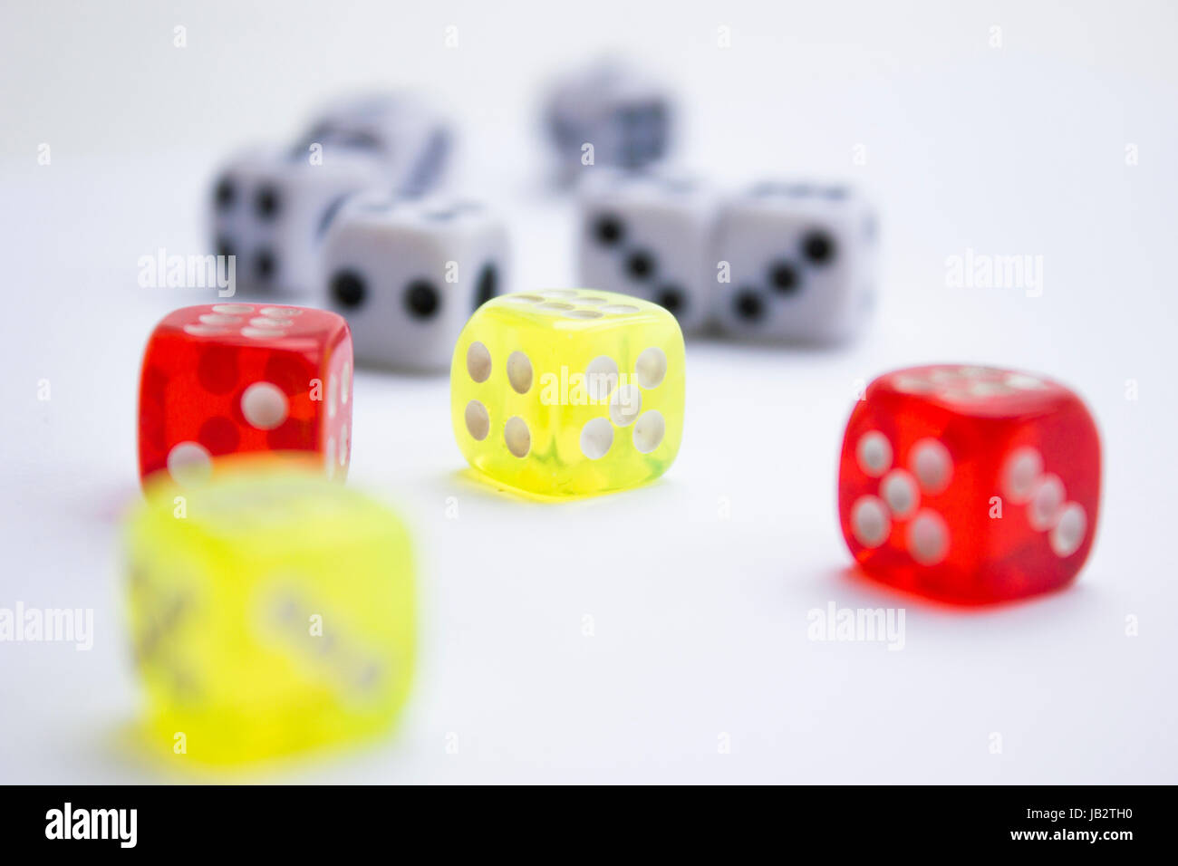 Composition from different colored dice on a white background Stock ...