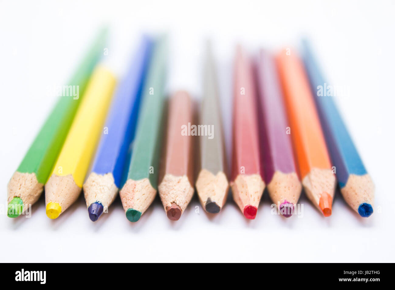 Different color pencils arranged on a white background Stock Photo - Alamy