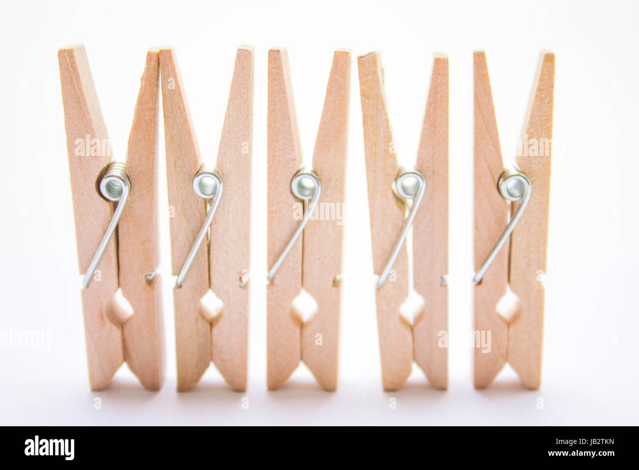 Composition of several wooden pegs on a white background Stock Photo ...