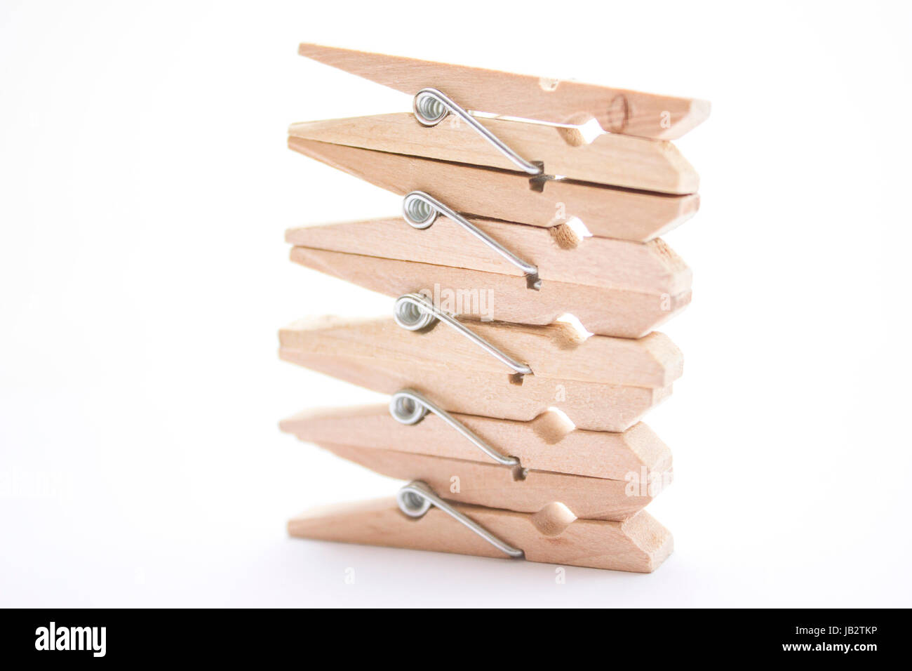 Composition of several wooden pegs on a white background Stock Photo ...