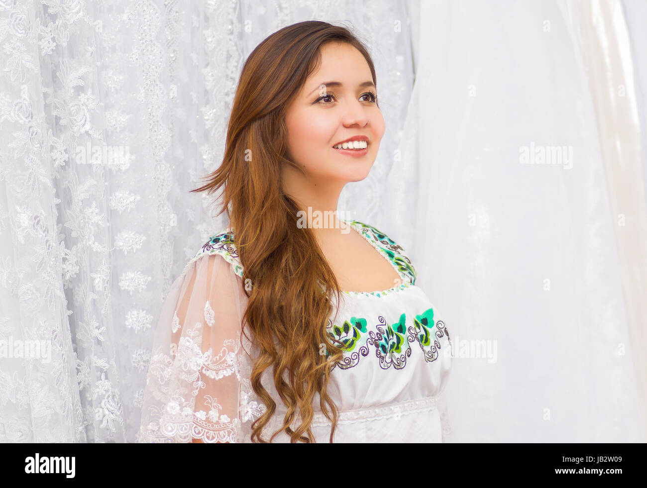 Beautiful smiling young woman wearing andean traditional clothing and ...