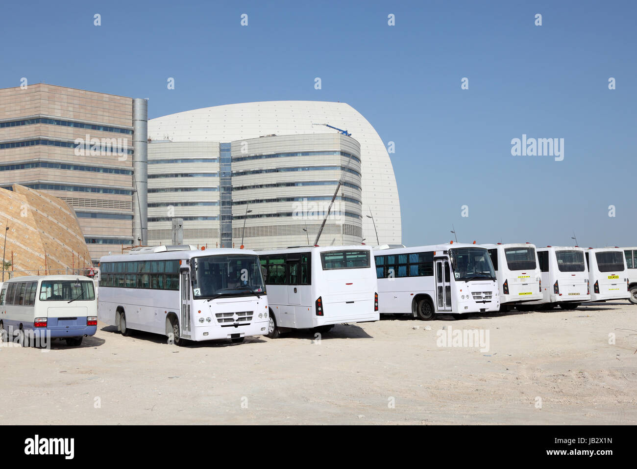 Buses for workers at a construction site in Doha, Qatar, Middle East ...