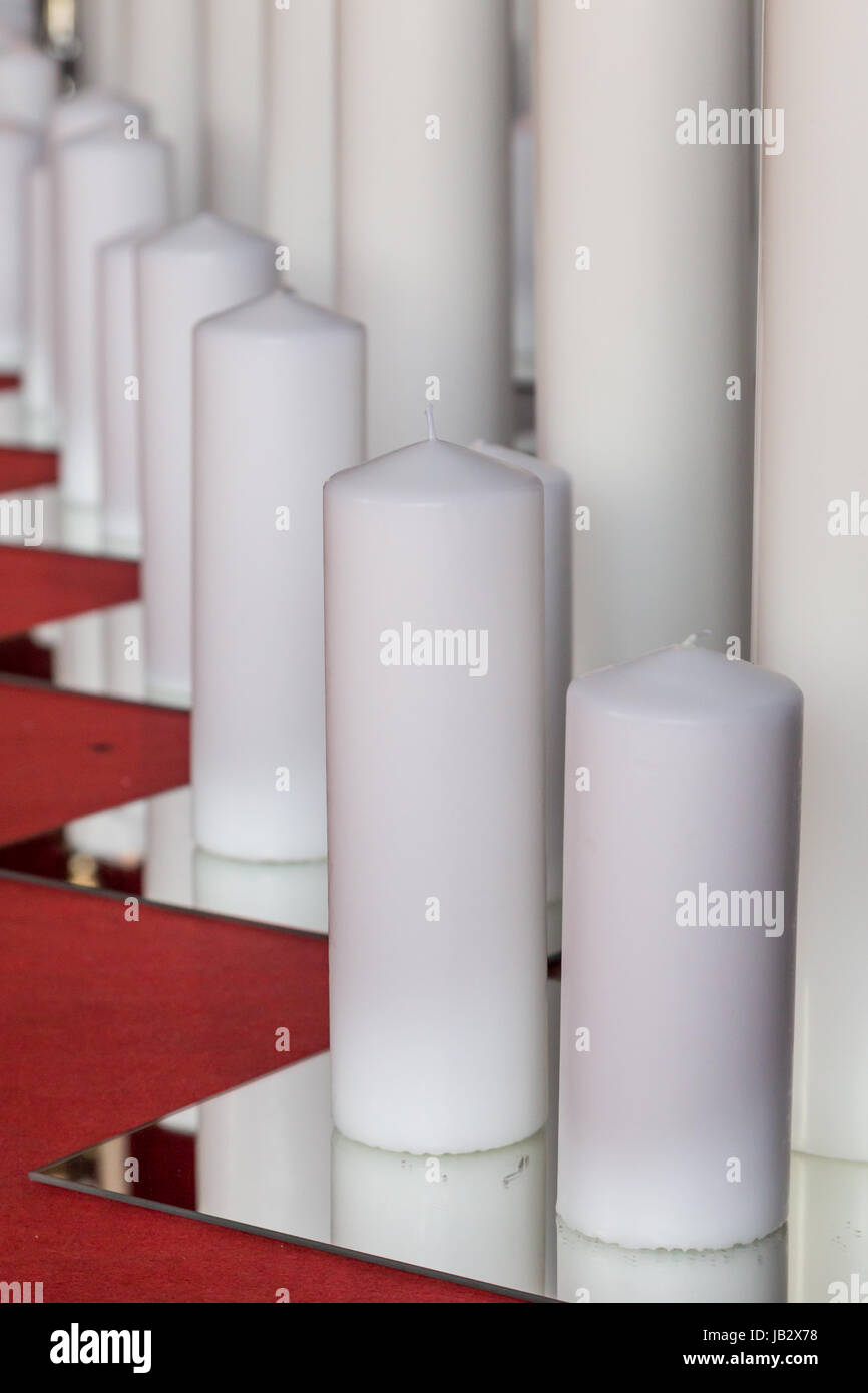 burning big candle in different size with flame Stock Photo - Alamy