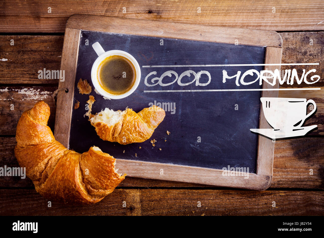 Good morning sign with a cup of fresh hot morning coffee and a broken ...