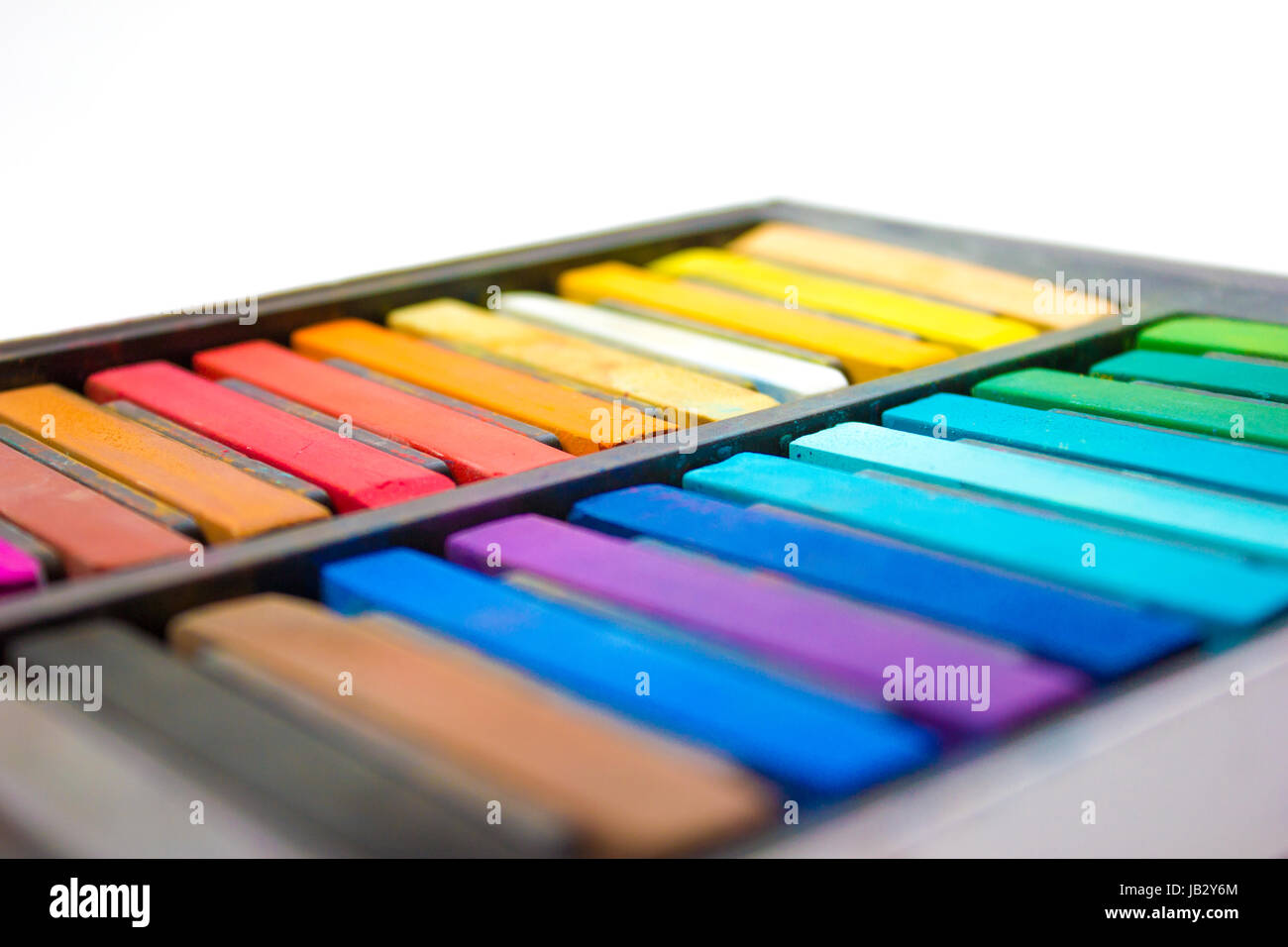 Different colors of pastels in their casing Stock Photo - Alamy