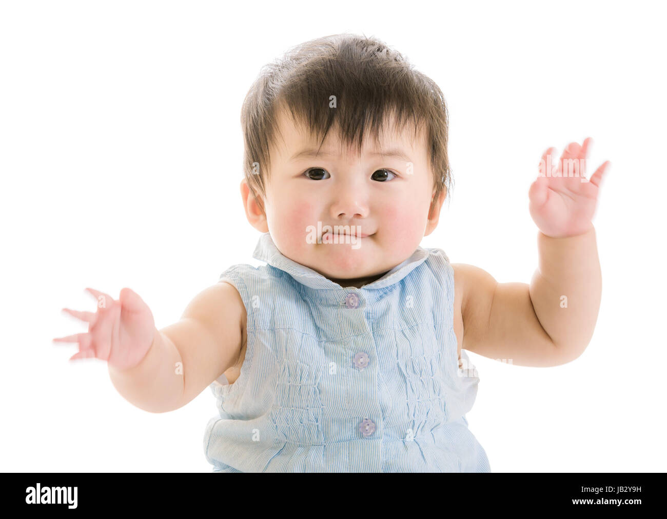 Little girl with hands up Stock Photo - Alamy