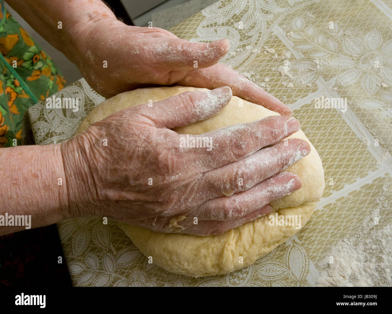Hands of old woman making dough Stock Photo - Alamy