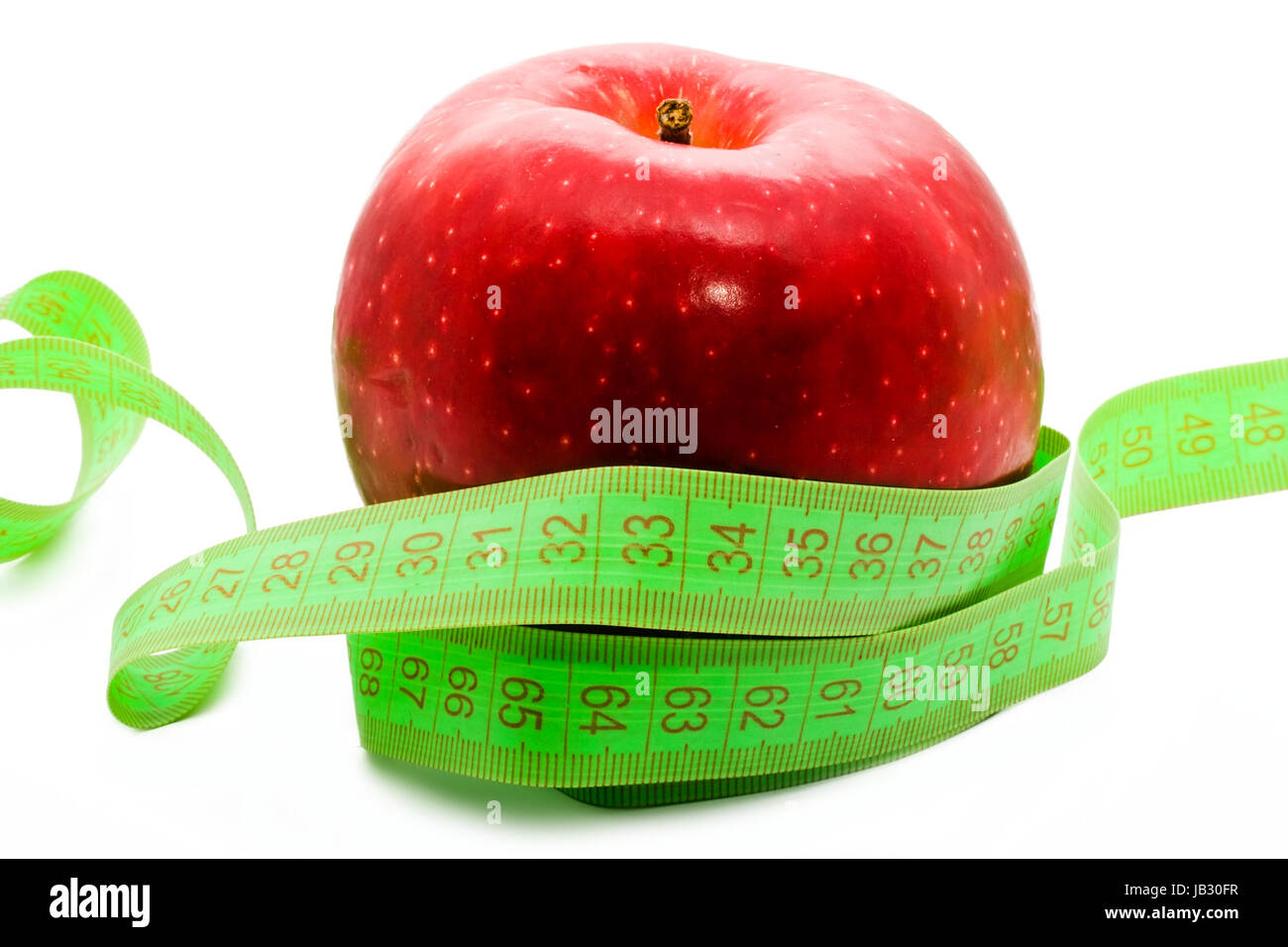 Measuring a red apple Stock Photo - Alamy