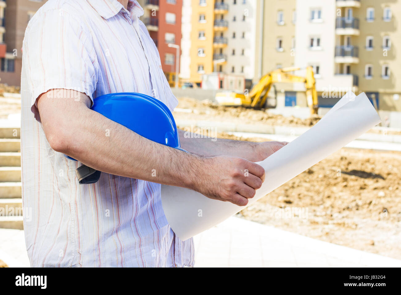 Construction manager looking project on building site Stock Photo - Alamy