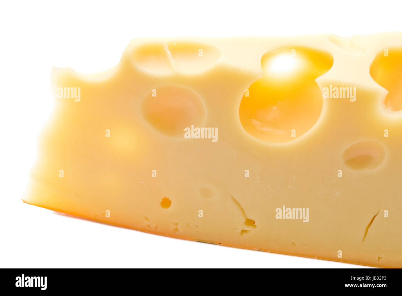 Cheese with large eyes isolated on white Stock Photo - Alamy